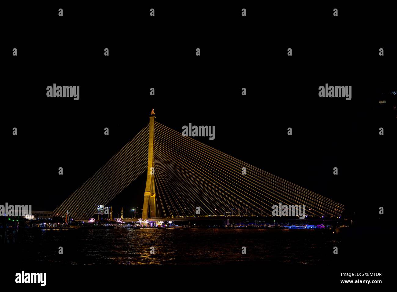Night view of the Rama VIII Bridge crossing the Chao Phraya River in ...