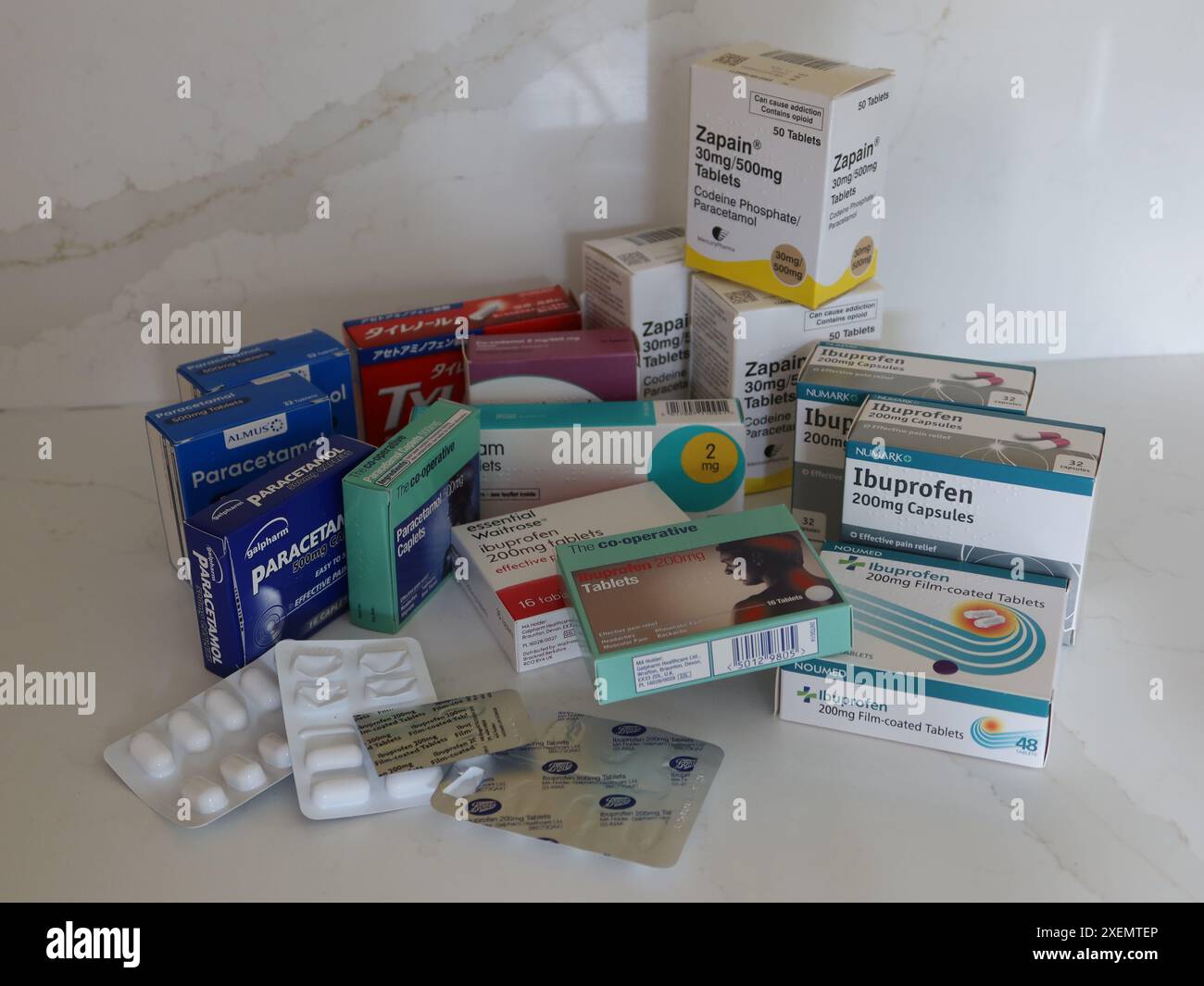 Array of painkillers: variety of packets of paracetamol, opioid and ...