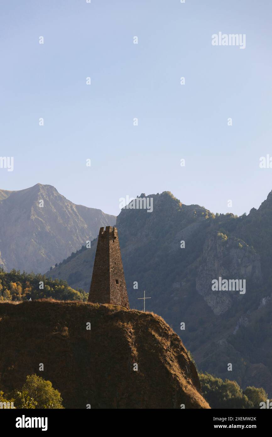 Truso Gorge with cross and watchtower on the edge or a mountainside ...