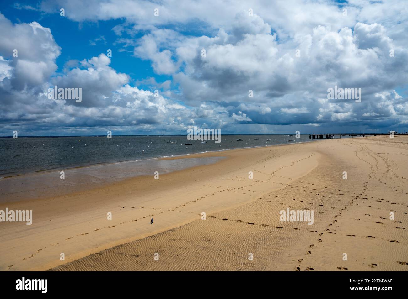 Walking on beach promenade in sunny Arcachon, vacation destination town ...