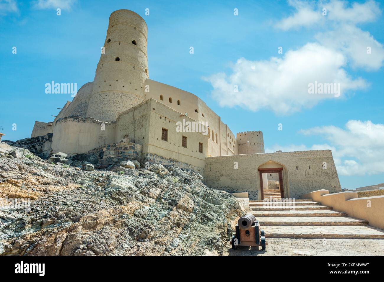 Bahla citadel fortress stone walls and round towers with old cannon the ...