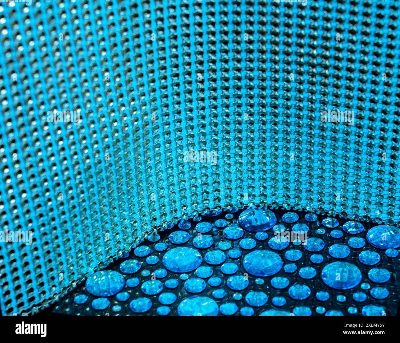 Curve of blue rhinestone jewel wall surrounds sparkling blue round gems ...
