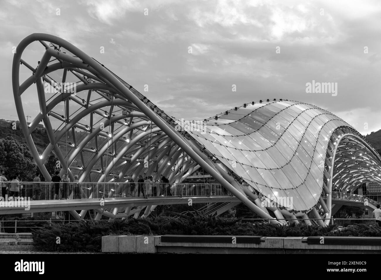 Tbilisi, Georgia - June 16, 2024: The Bridge of Peace is a bow shaped ...
