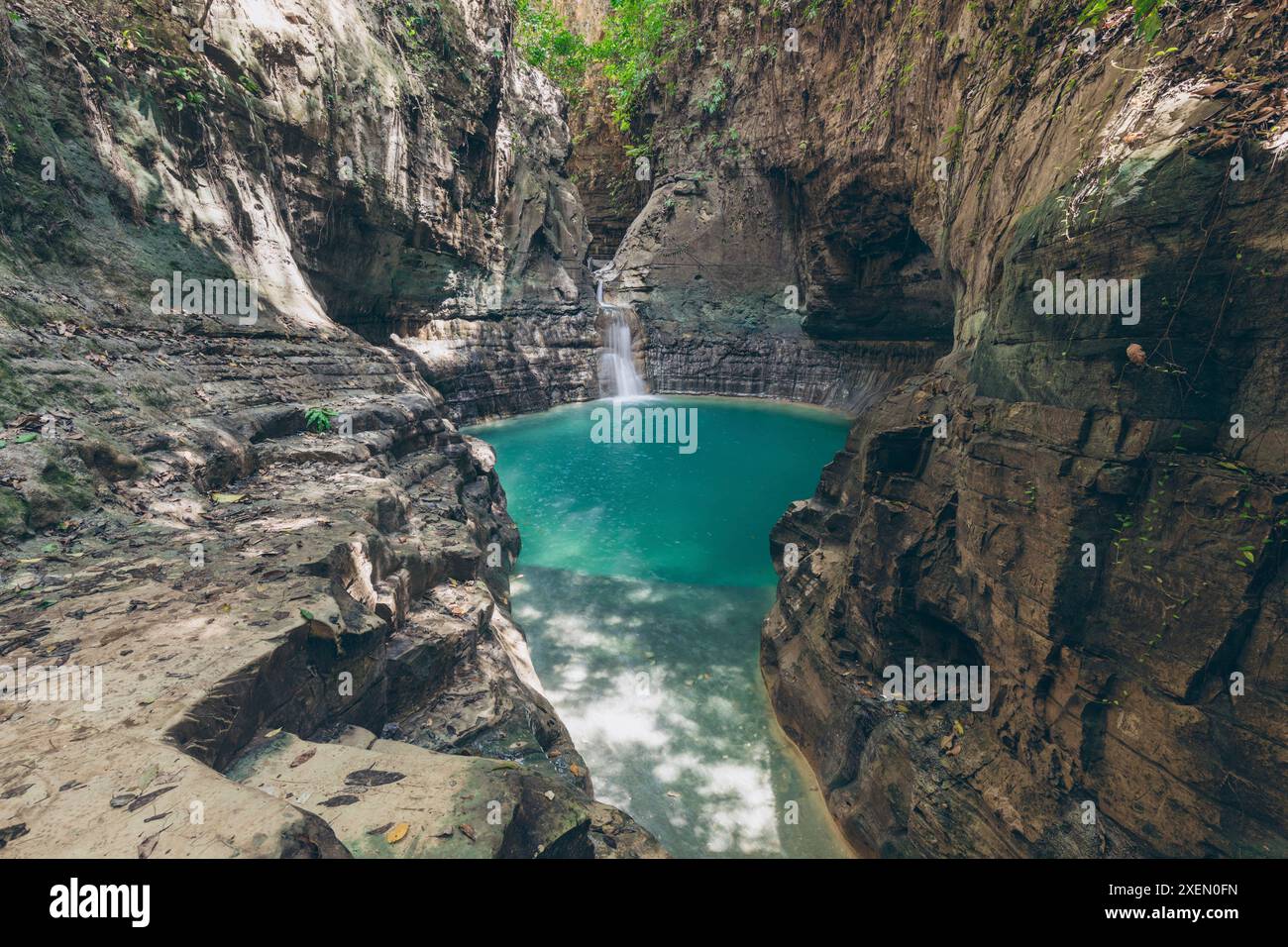 Stunning lagoon and waterfall at Air Terjun Wai Marang on the island of ...
