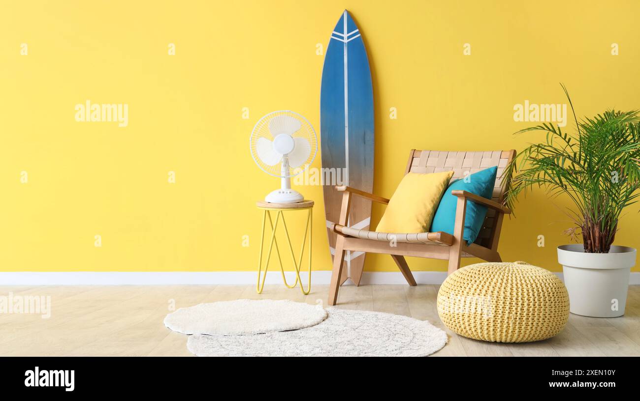 Interior of stylish living room with armchair, fan on table and ...