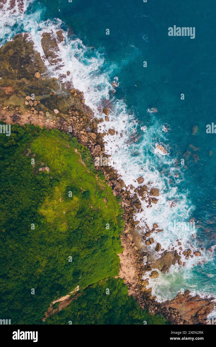 Aerial view of the rugged coastline and lush vegetation on Seger Beach ...