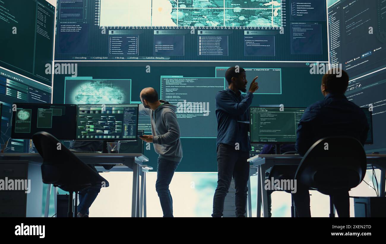 Governmental Hackers Analyzing Cyber Threats On Big Screens Managing Important Database Hacking