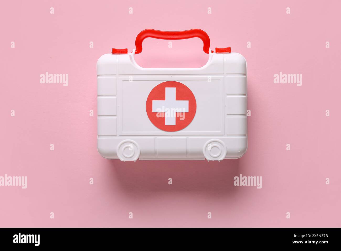Toy first aid kit on pink background. Top view Stock Photo - Alamy