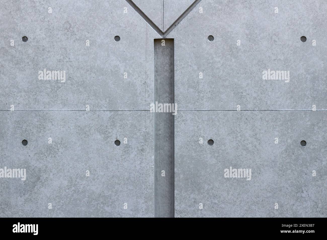Photo of a concrete wall with an abstract design as background material ...