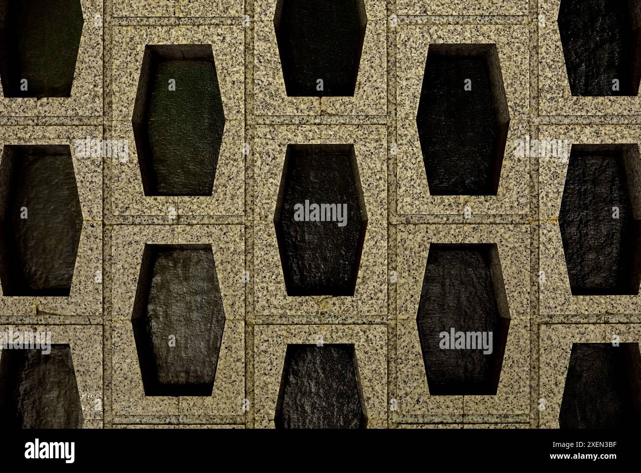 Photo of a wall made of perforated stone blocks for background material ...