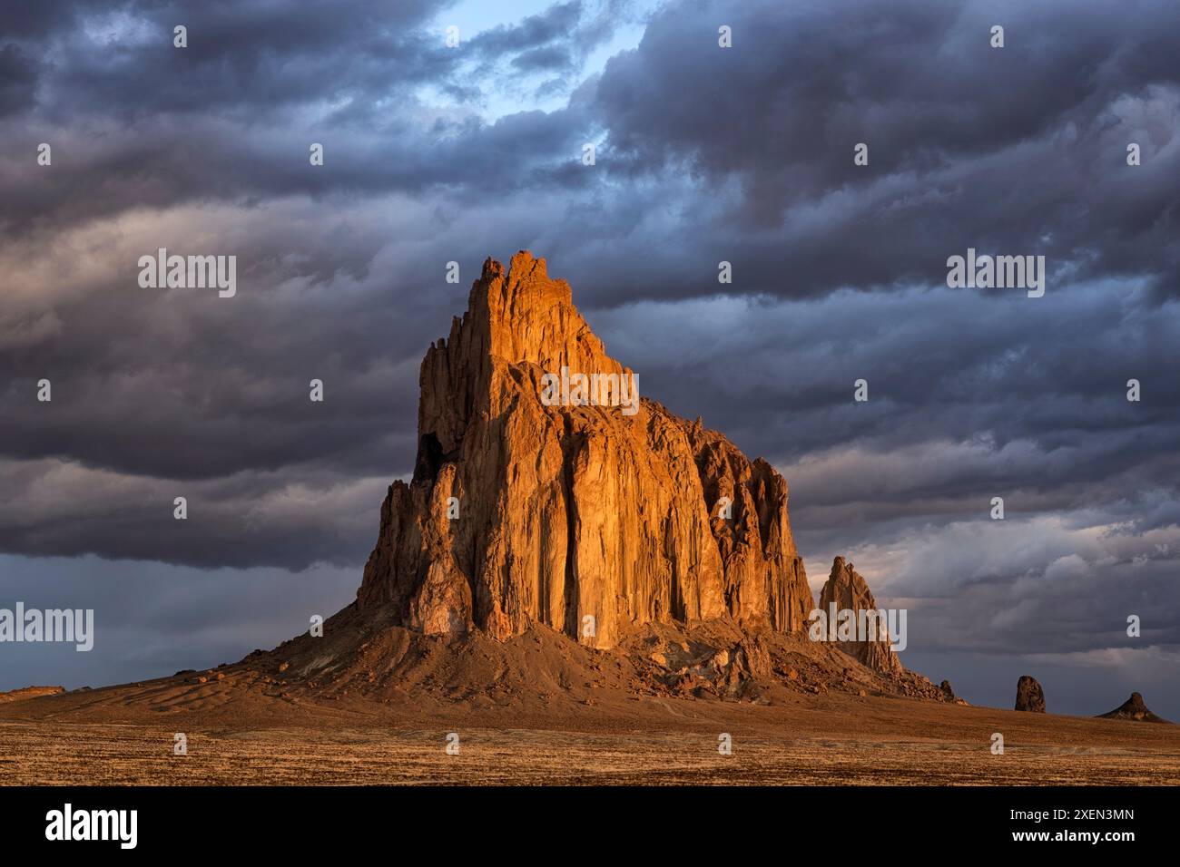 Storm clouds gather over Shiprock, New Mexico. The rising suns ...