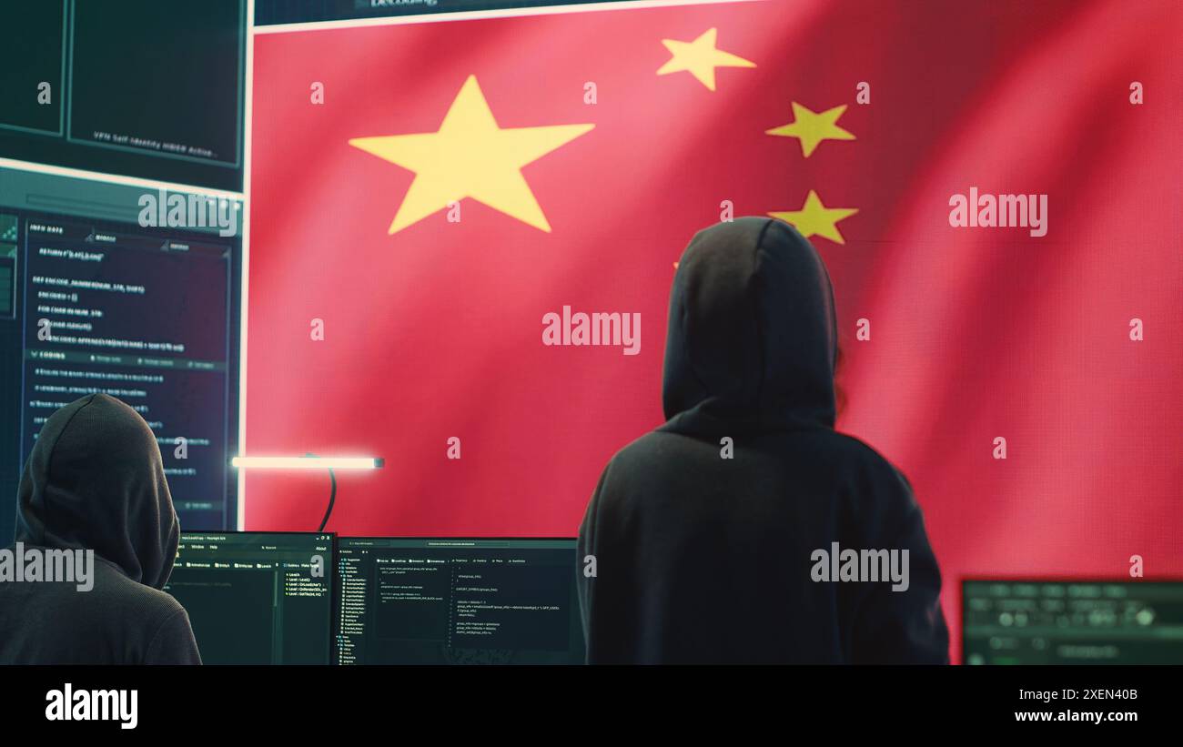 Governmental hacker in high tech office with Chinese flag shown on big ...