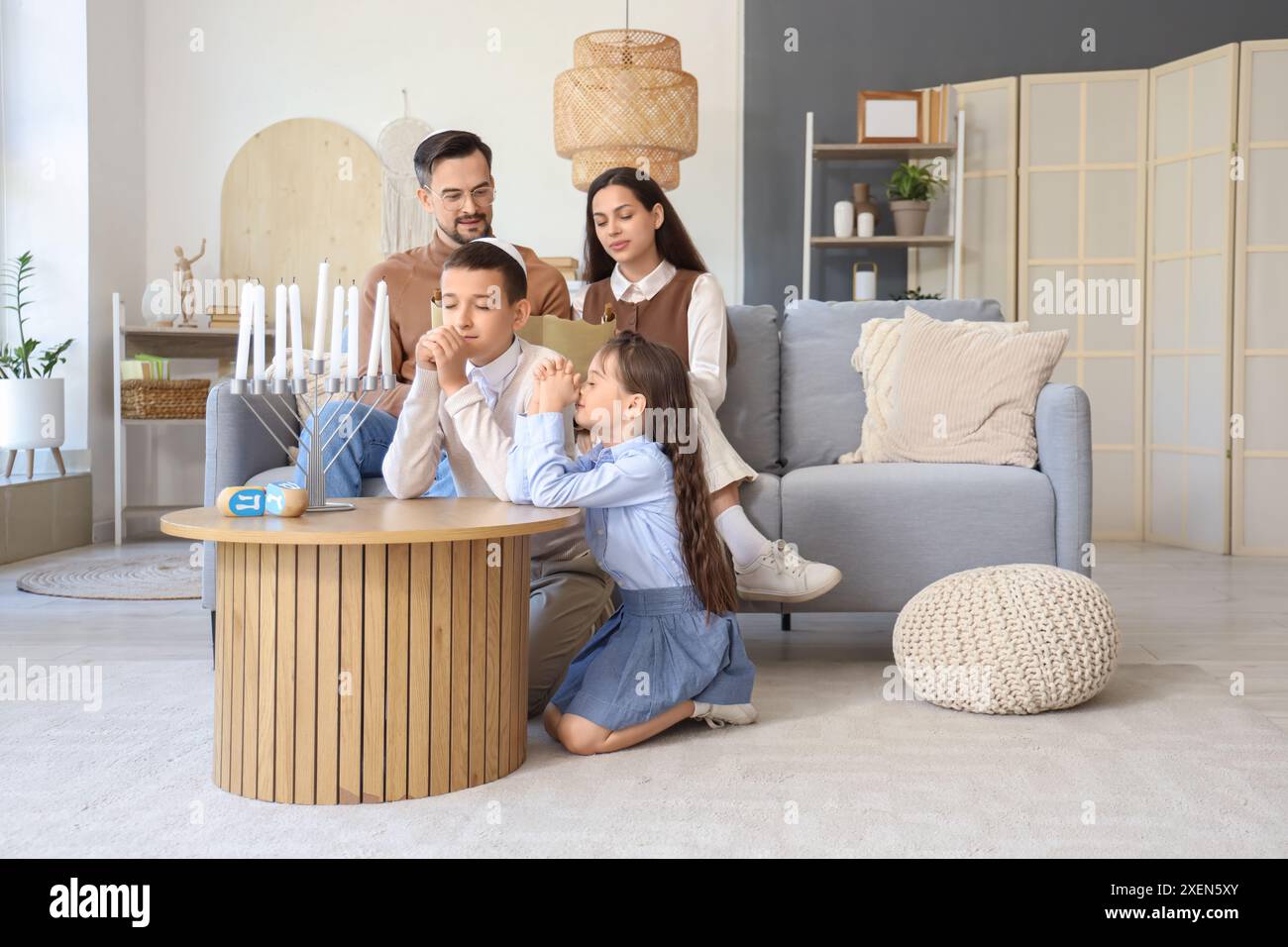 Little Jewish children with their parents praying at home Stock Photo ...