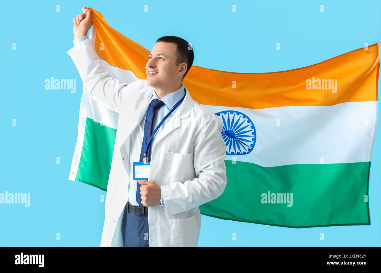 Male doctor with flag of India on blue background. National Doctor's ...