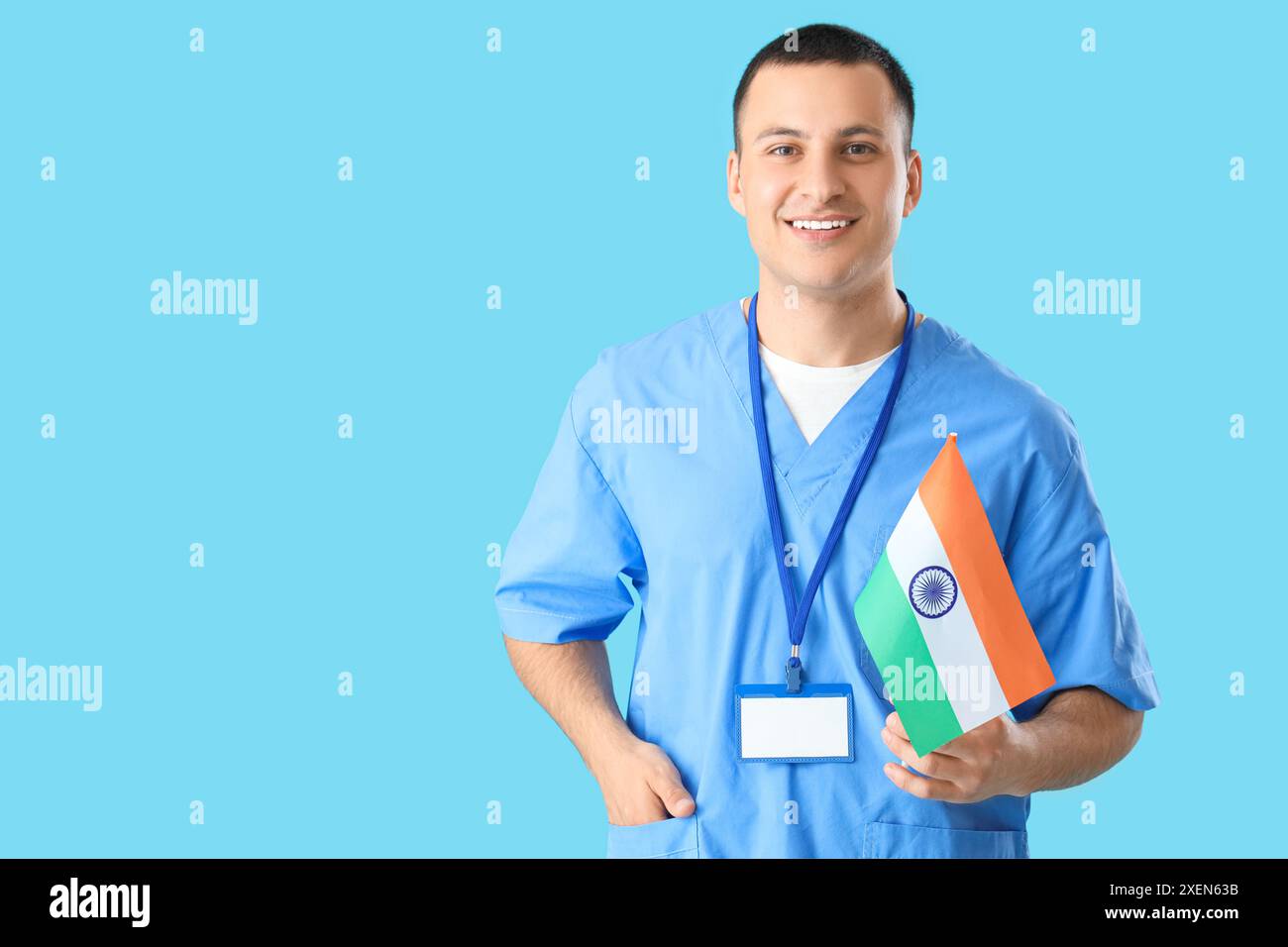 Male doctor with flag of India on blue background. National Doctor's ...