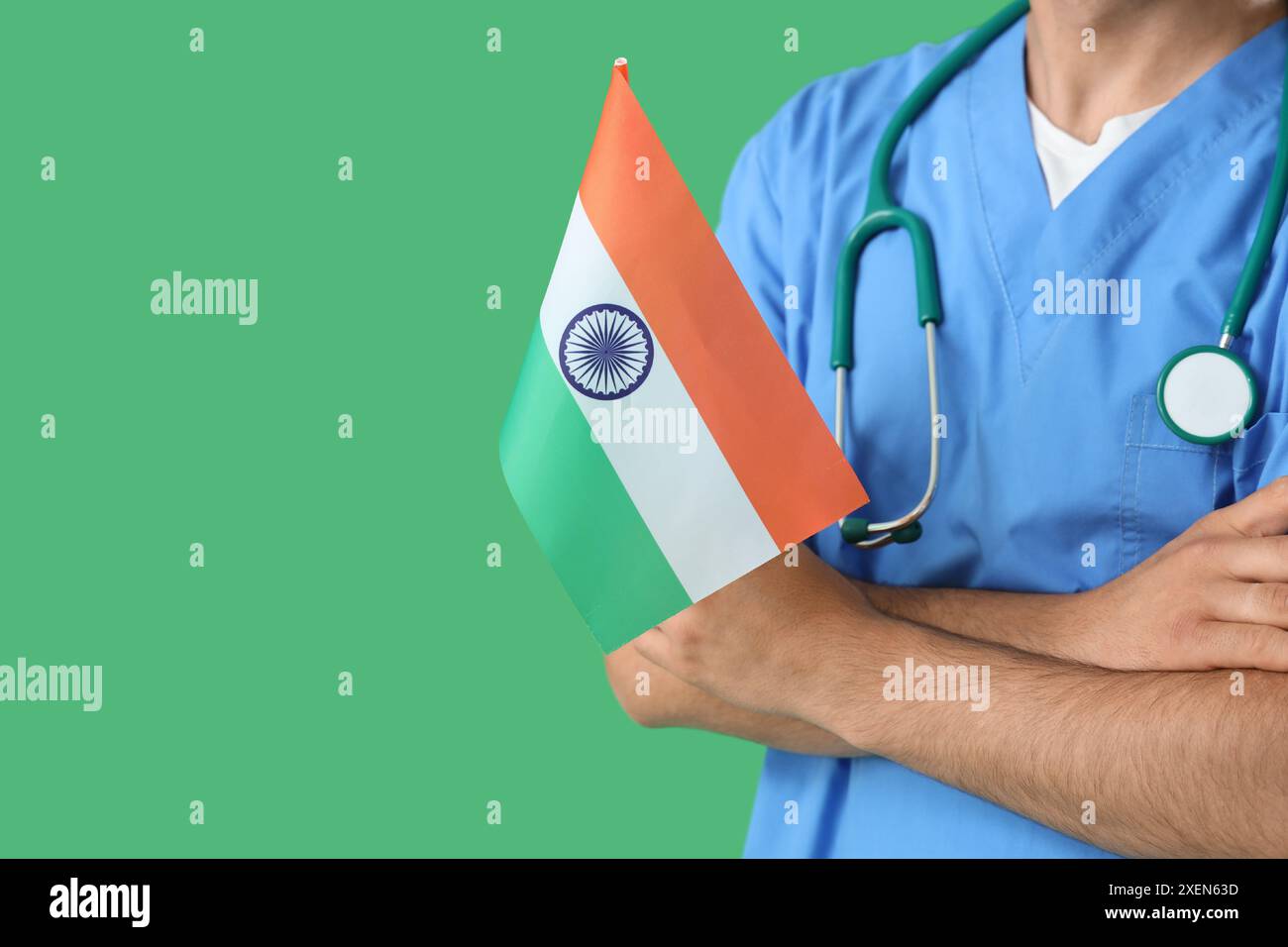 Male doctor with flag of India on green background, closeup. National ...