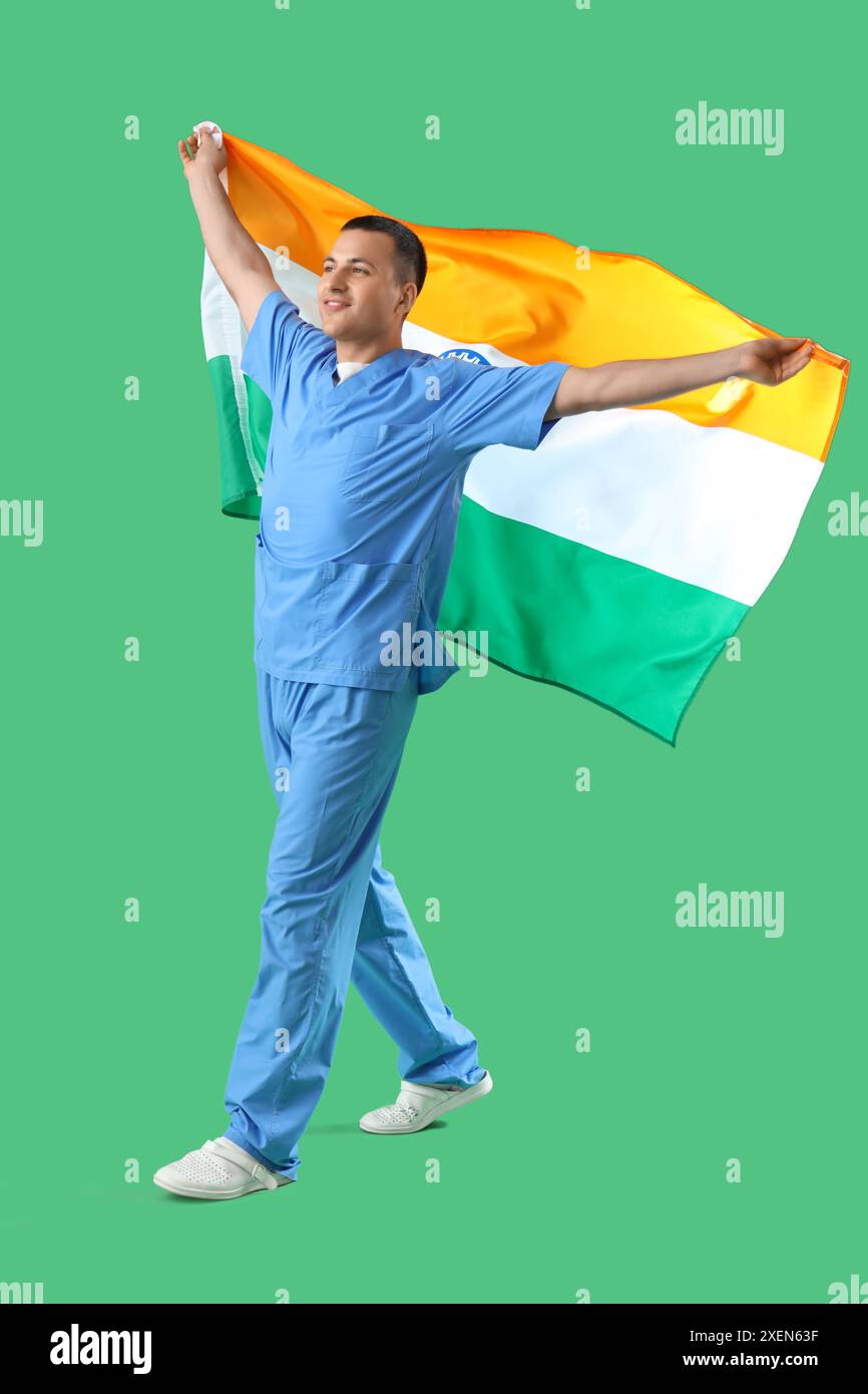 Male doctor with flag of India on green background. National Doctor's ...