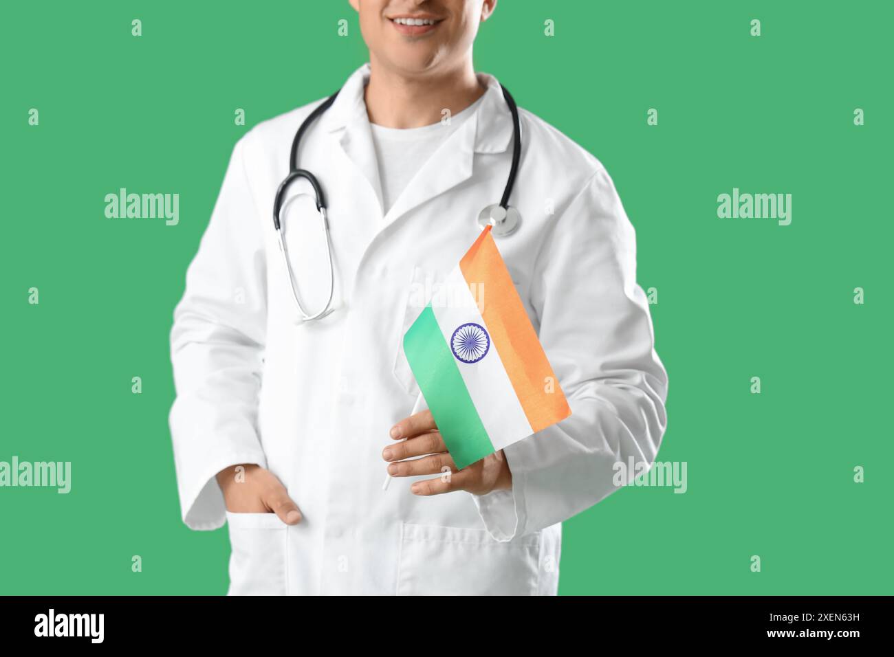Male doctor with flag of India on green background. National Doctor's ...