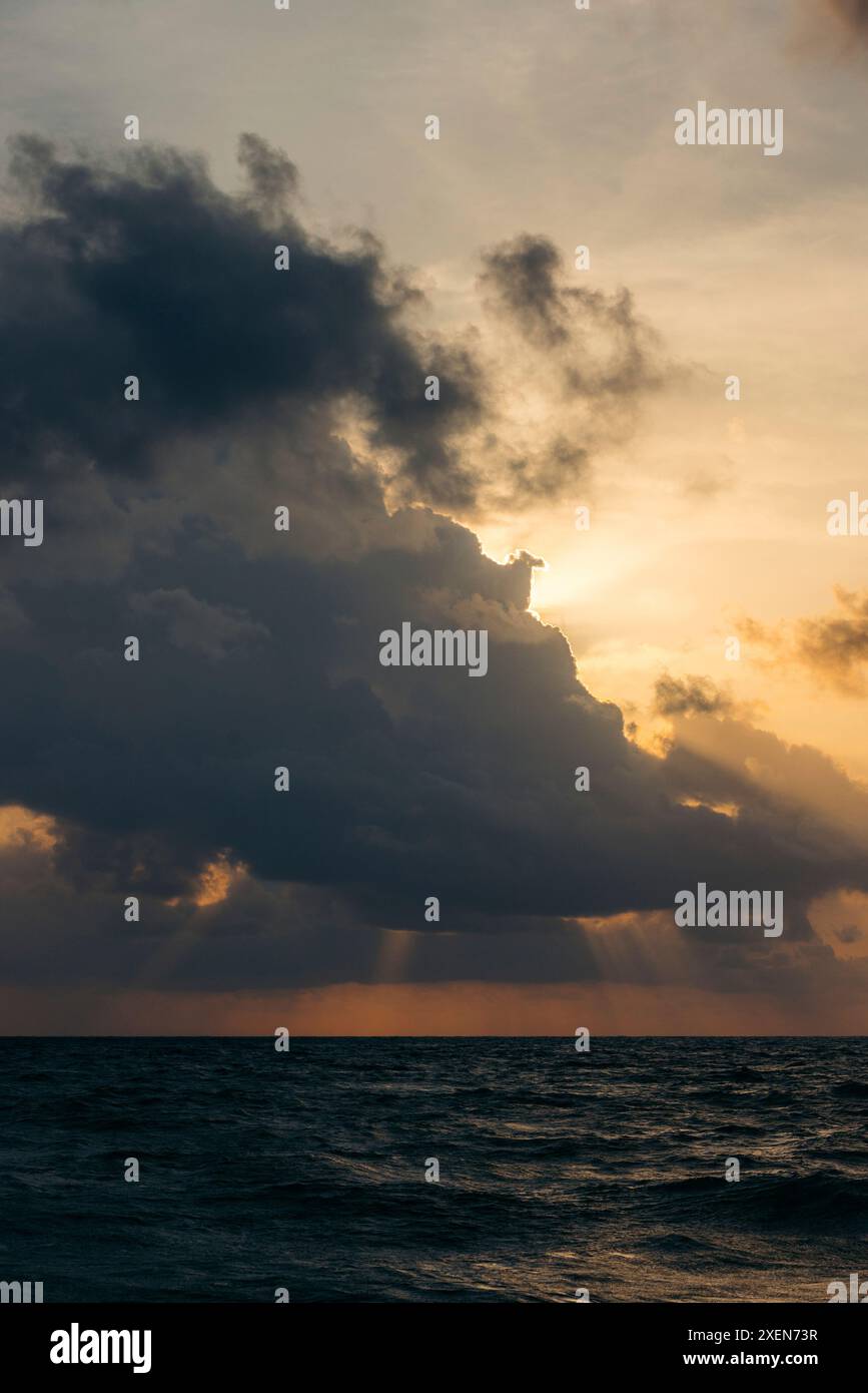 Dramatic sunset over the ocean at Mai Khao Beach in North Phuket; Mai ...