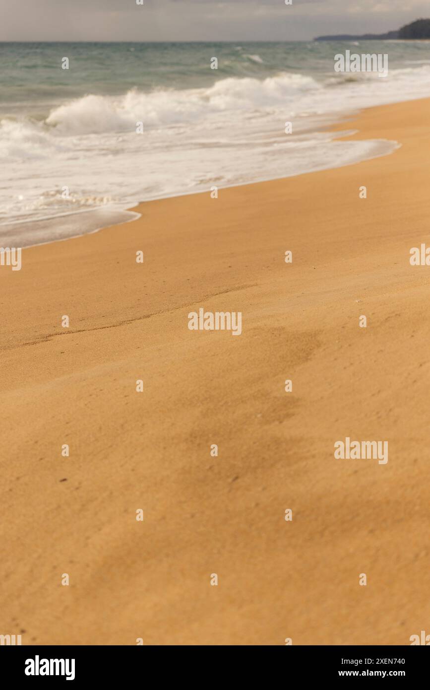 Sand and surf at sunset at Mai Khao Beach in North Phuket; Mai Khao ...