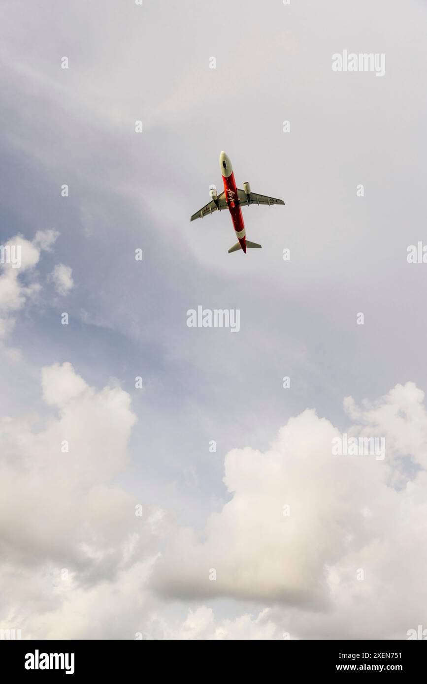 View from directly below of the underside of an airplane flying in a ...
