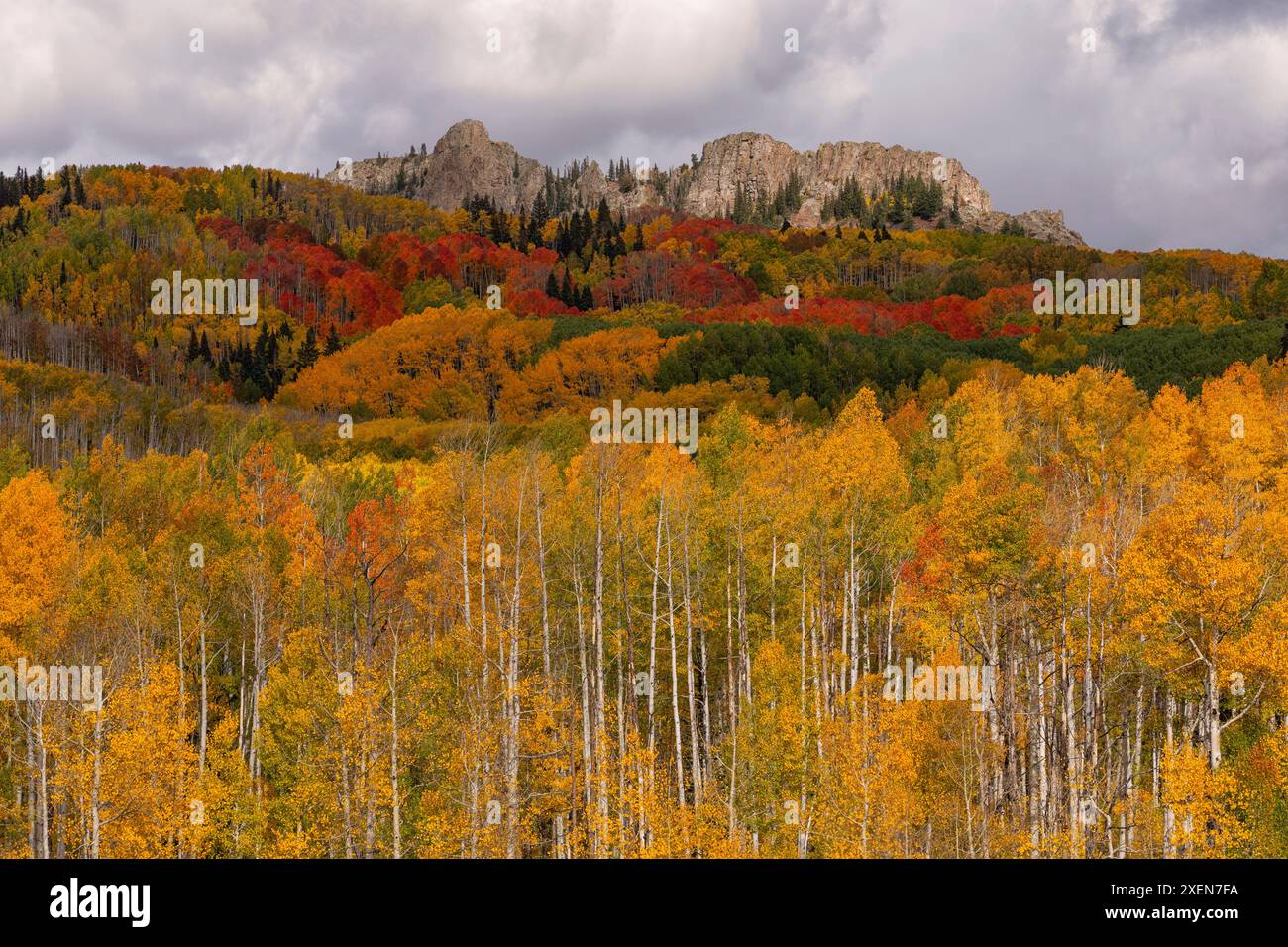 Scenic view of mountain peaks under grey clouds on the ridge of a ...