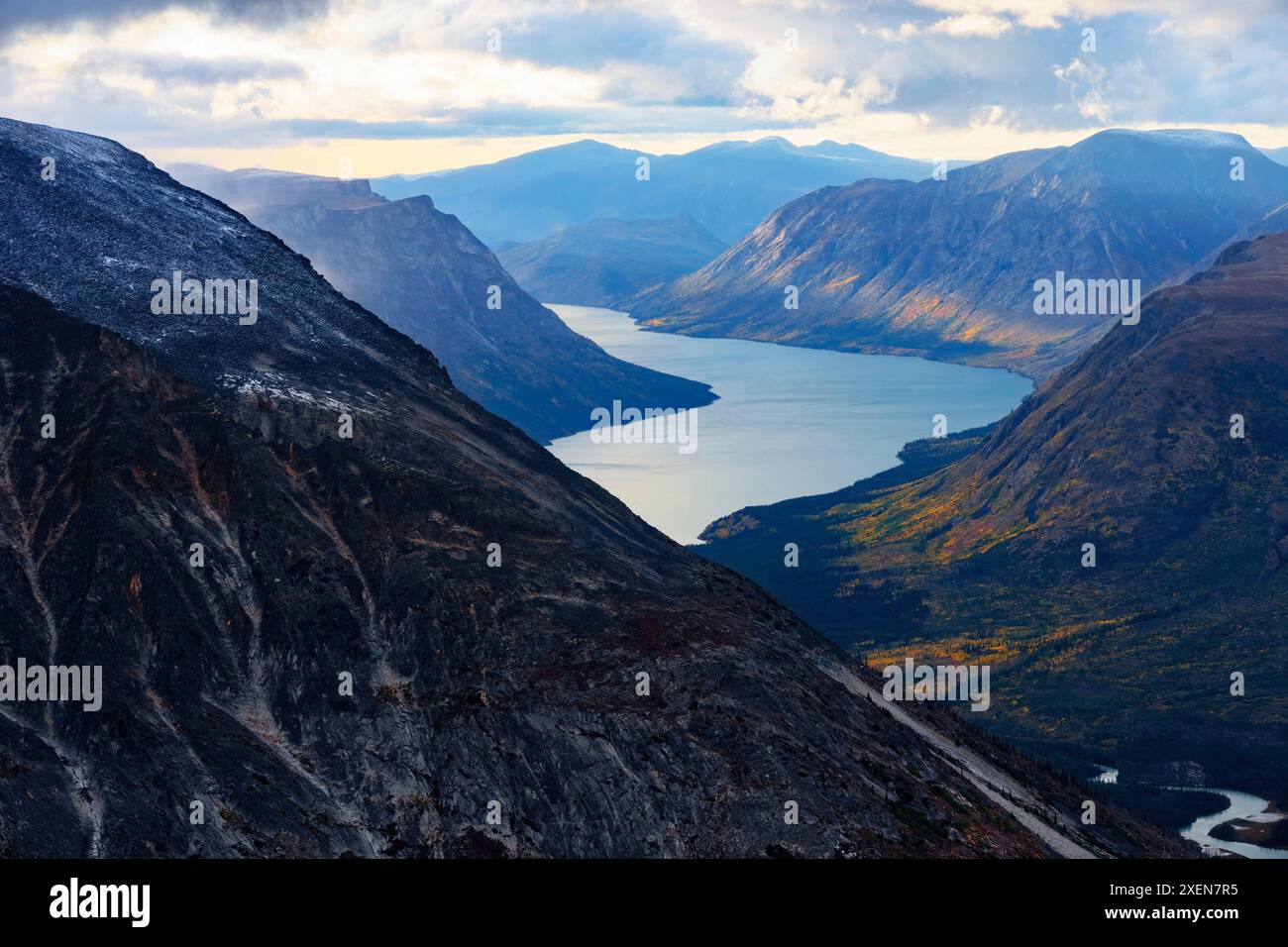 Aerial photos of a river flowing through the mountains surrounding ...