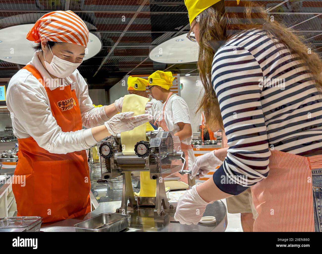 June 28, 2024, S?En, Osaka, Japan: A visitor seen rolling the noodles ...