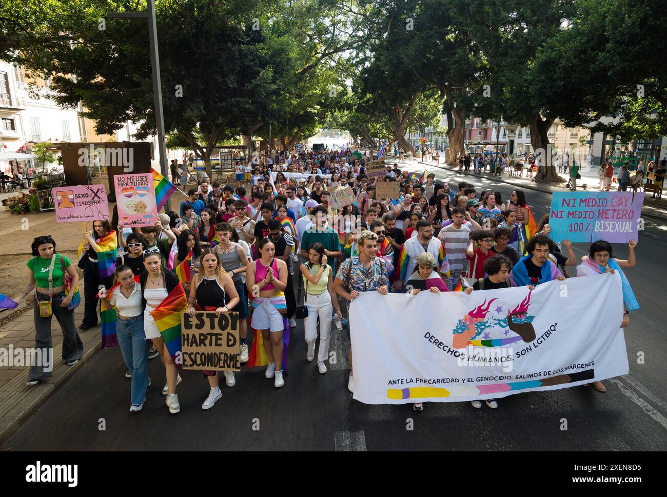 A general view shows protesters carrying a large banner in favor of ...