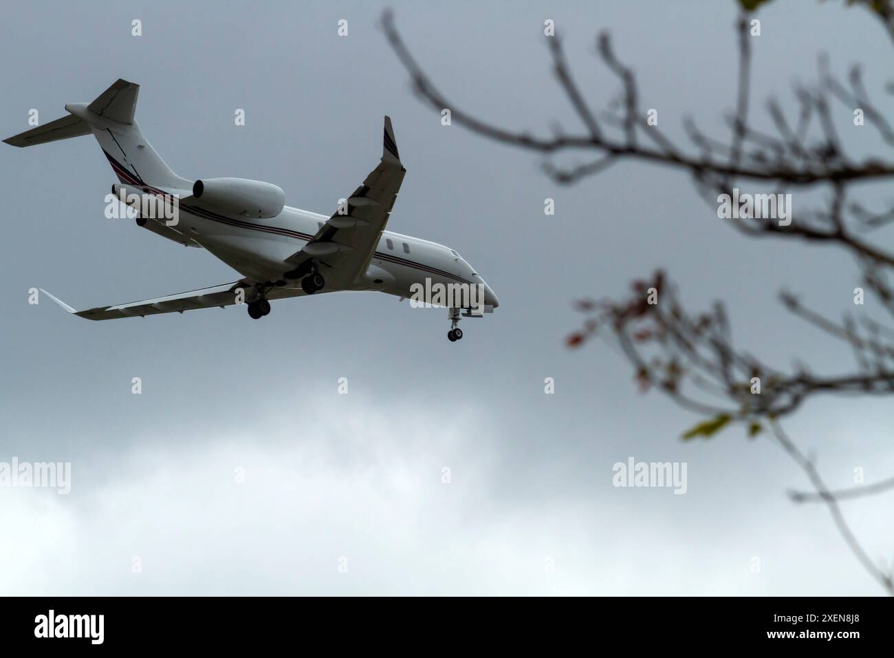 Private Jet landing in bad weather Stock Photo - Alamy