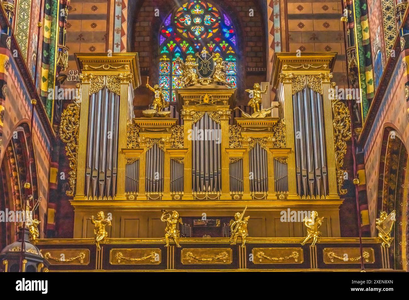 Colorful golden organ stained glass, St. Mary's Basilica, Krakow ...