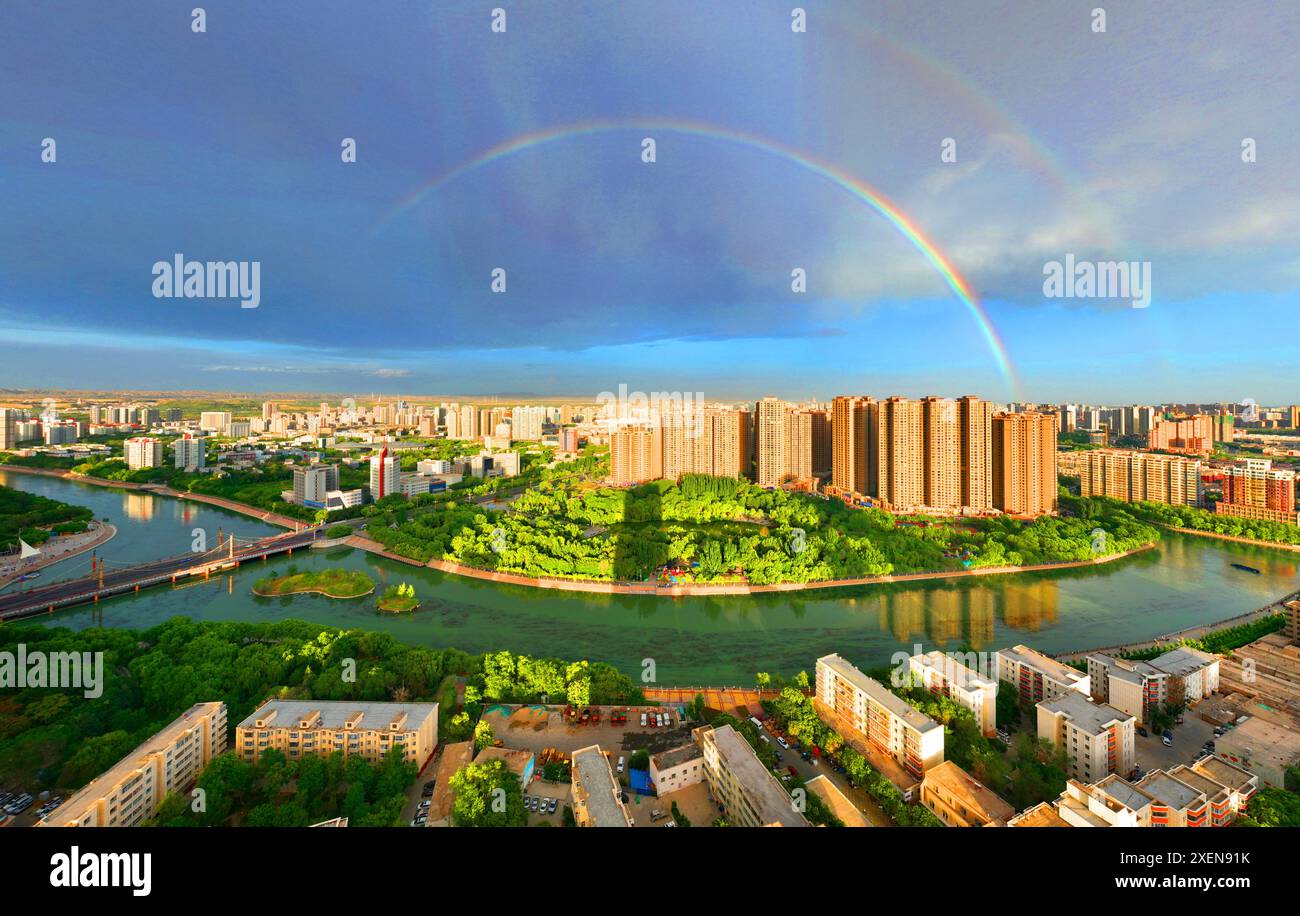 KORLA, CHINA - JUNE 28, 2024 - A beautiful rainbow is seen after a rain ...