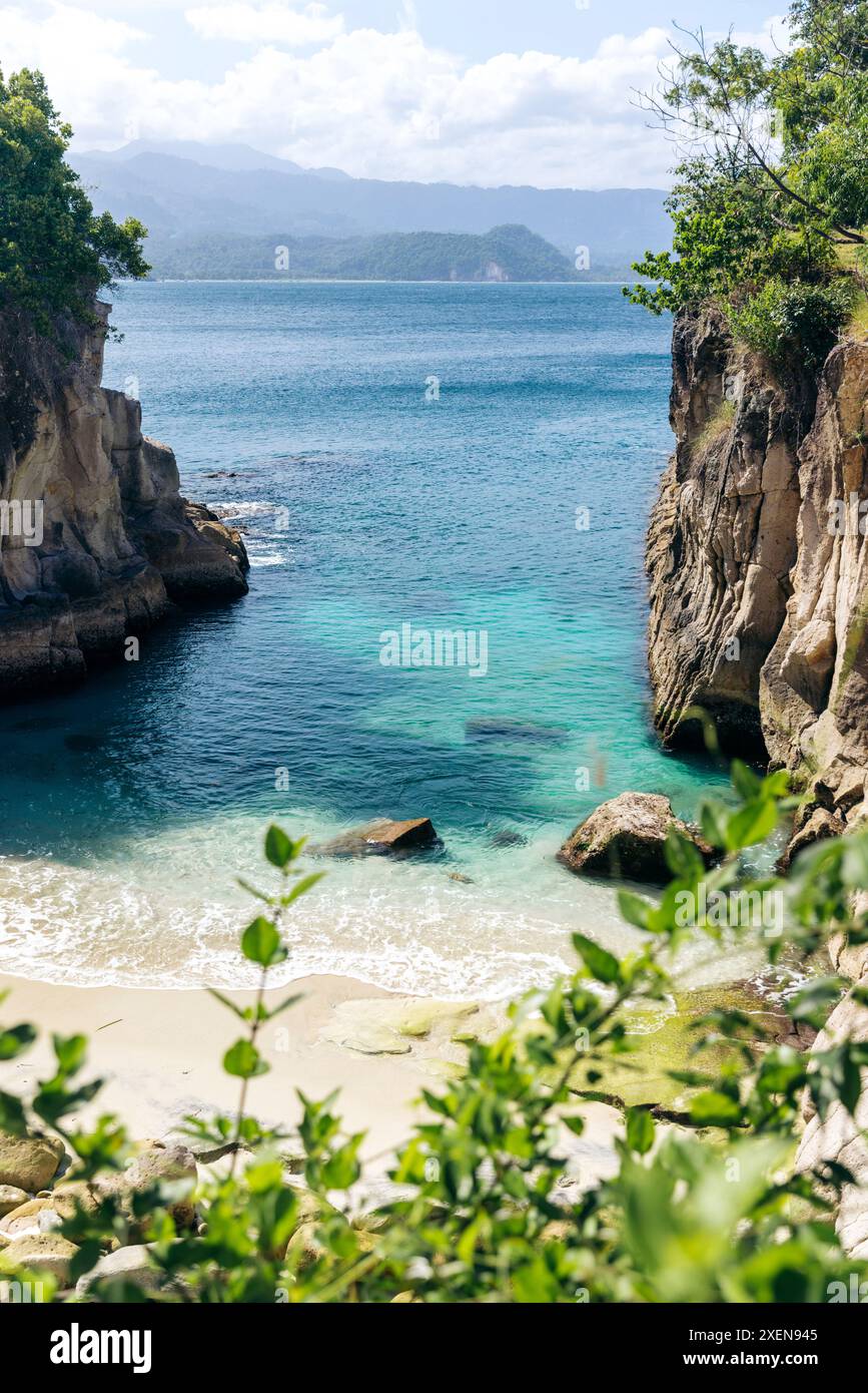 Patokan Beach (Jiko) with a small inlet surrounded by cliffs and ...