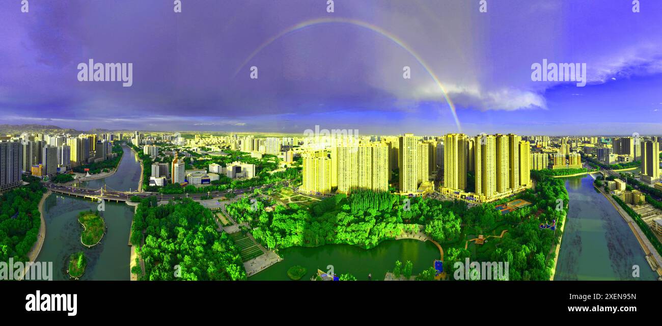 KORLA, CHINA - JUNE 28, 2024 - A beautiful rainbow is seen after a rain ...