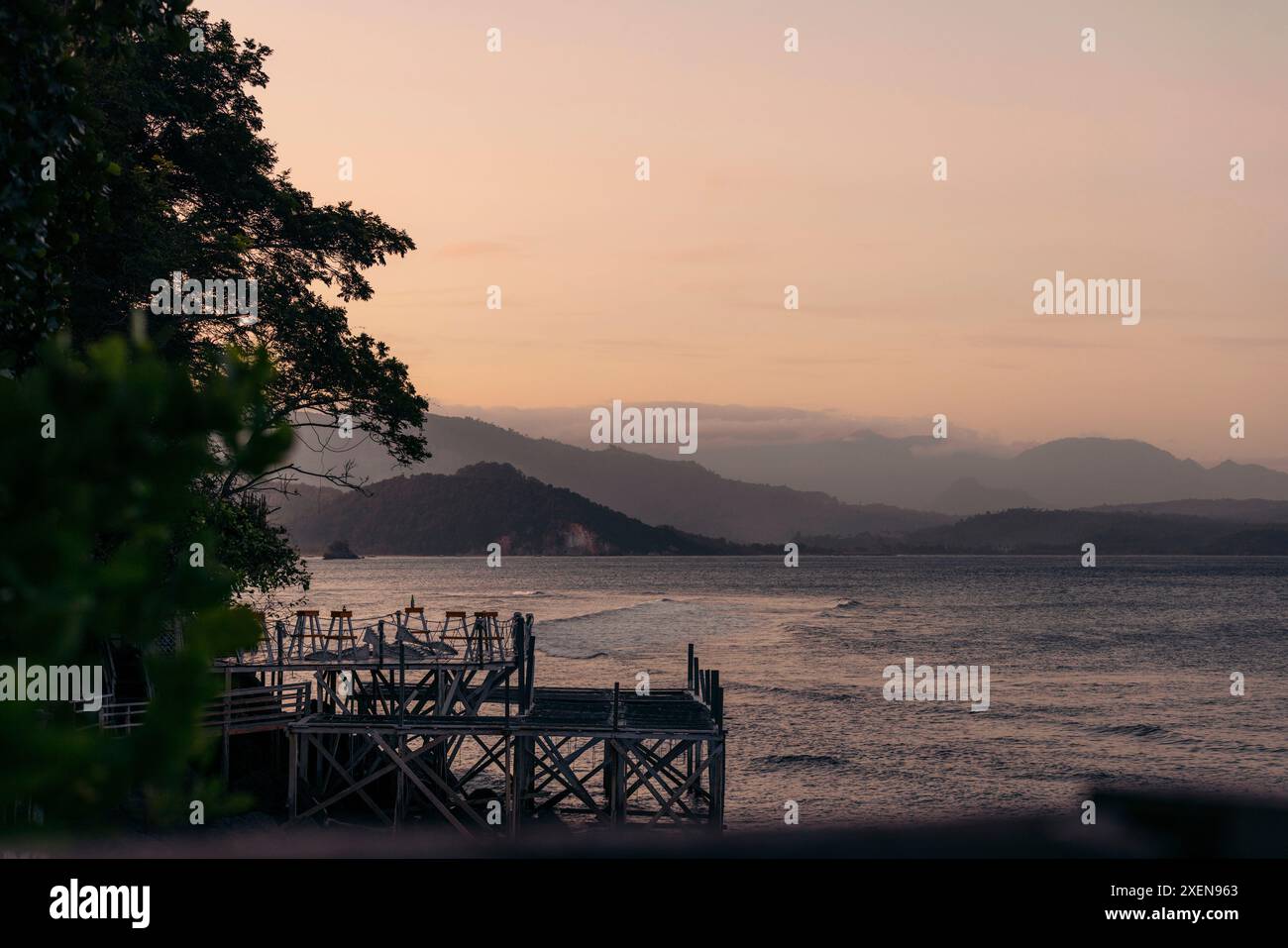 Sunset over Patokan Beach (Jiko) and silhouetted hillsides in North ...