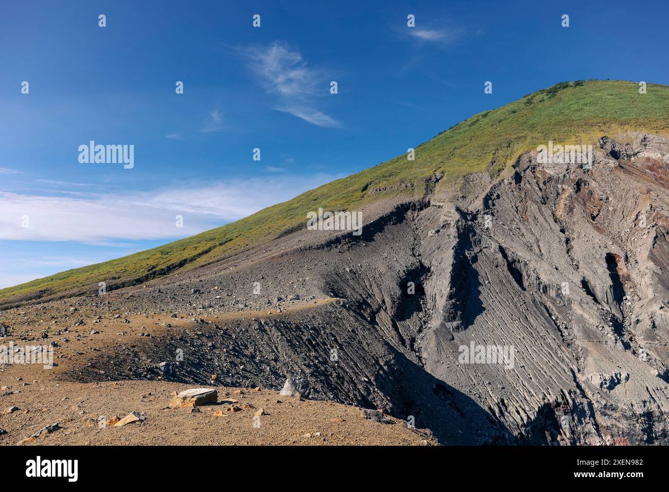 Landscape at Mount Lokon crater with scree and vegetation on the ...