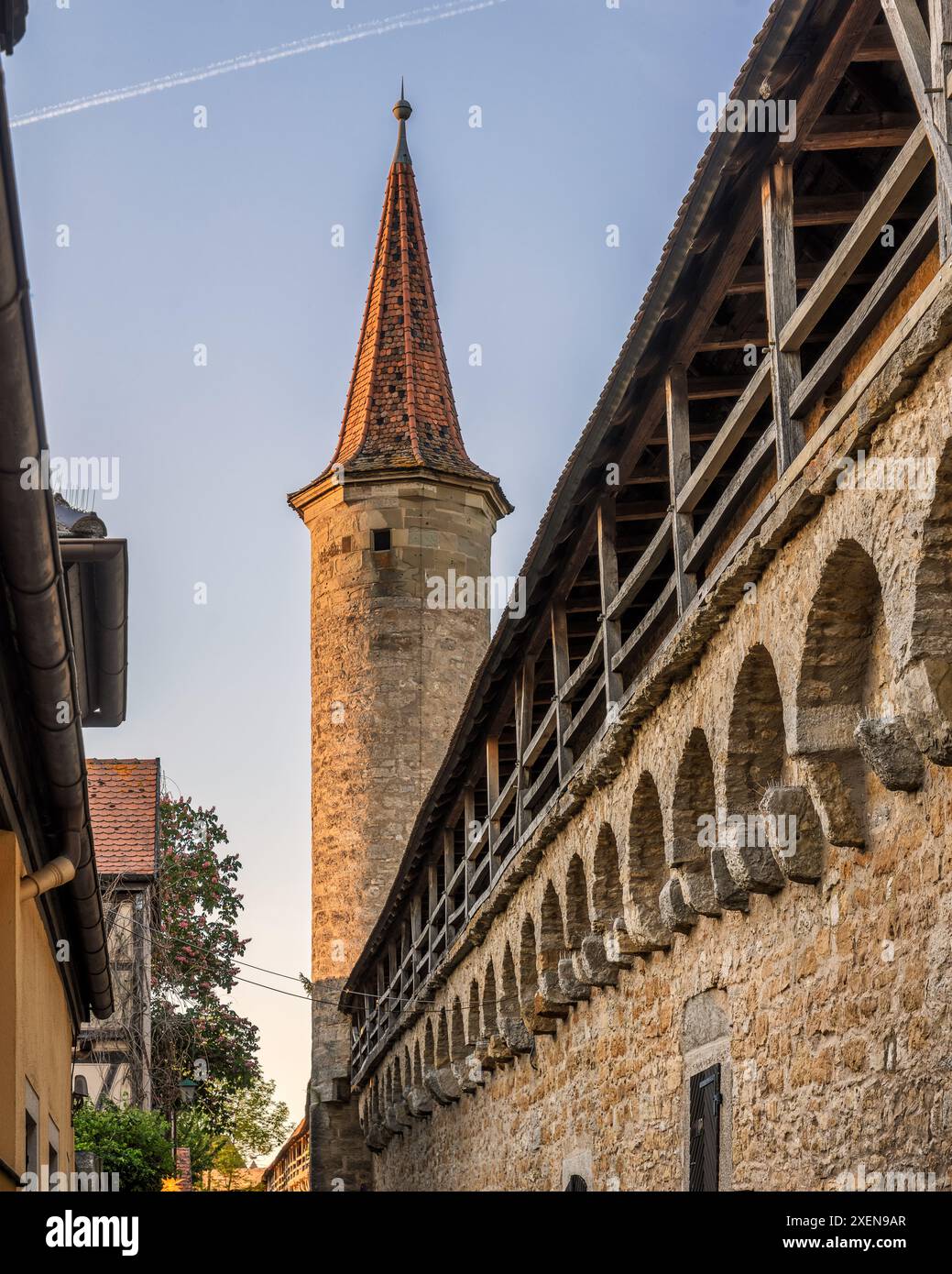 The beautiful view of the city wall of Rothenburg ob der Tauber with ...