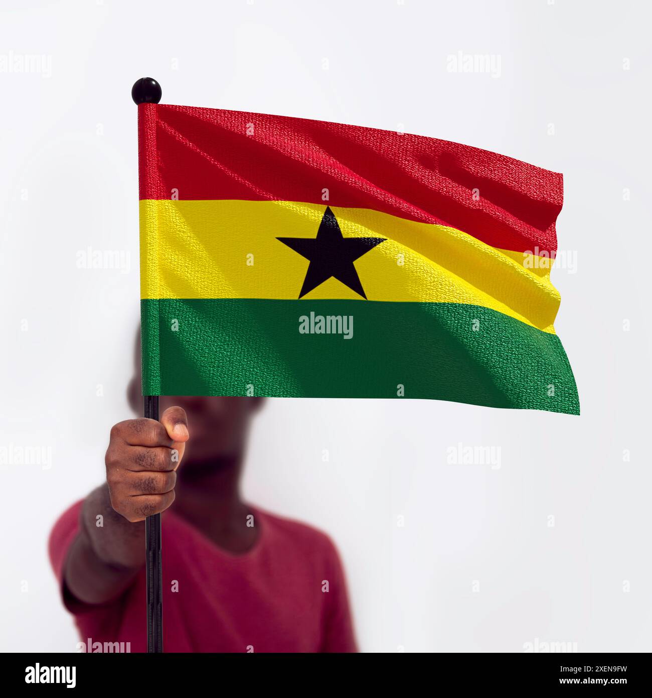 Black african male holding Ghanaian national flag against white ...