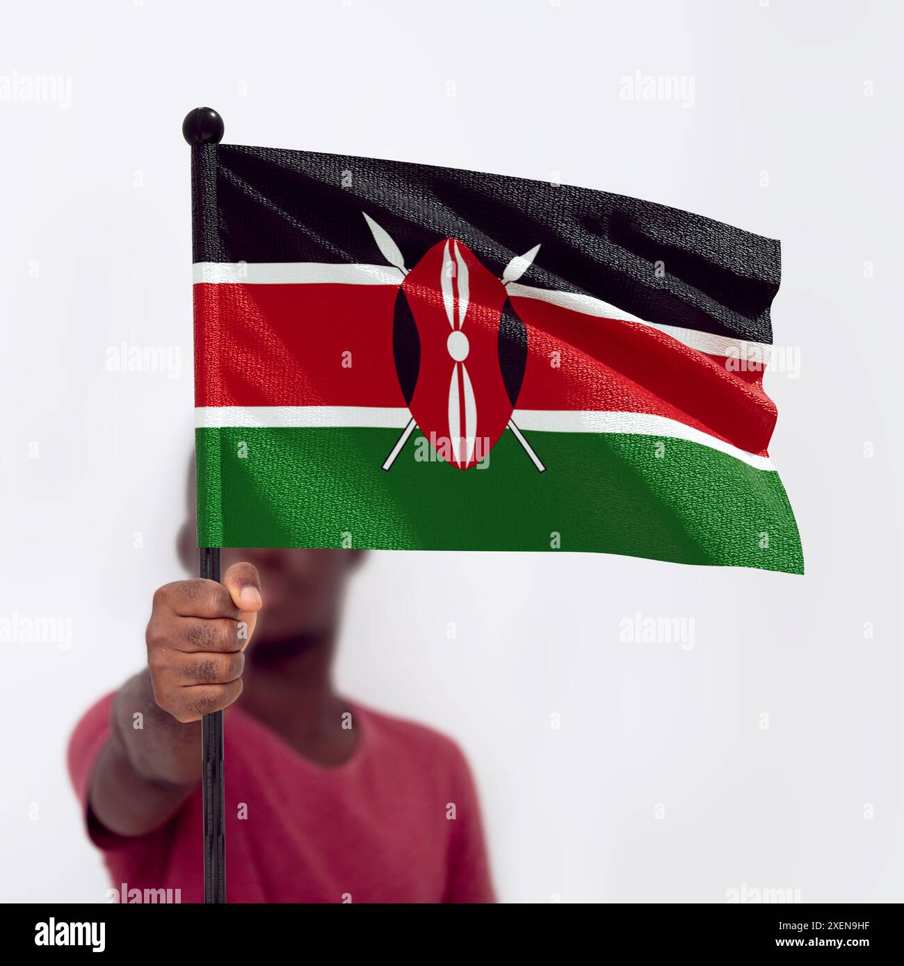 Black african male holding Kenyan national flag against white ...