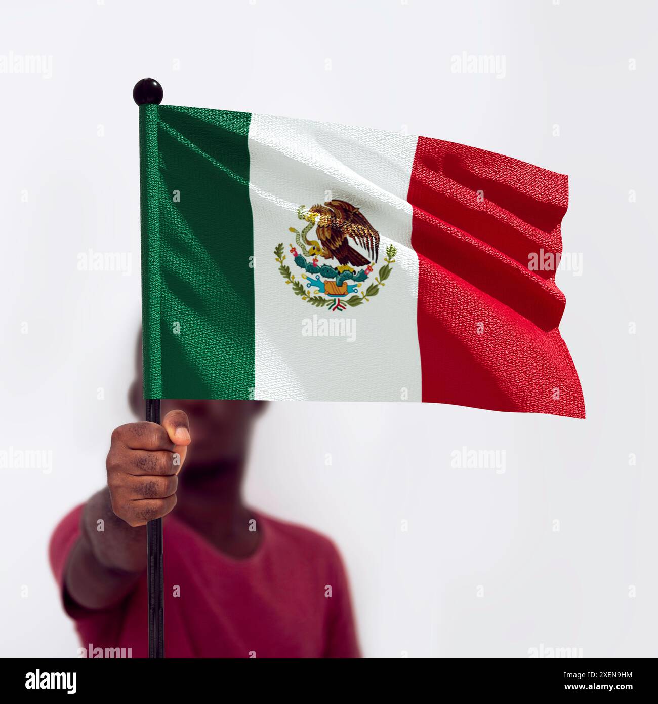 Black african male holding Mexican national flag against white ...