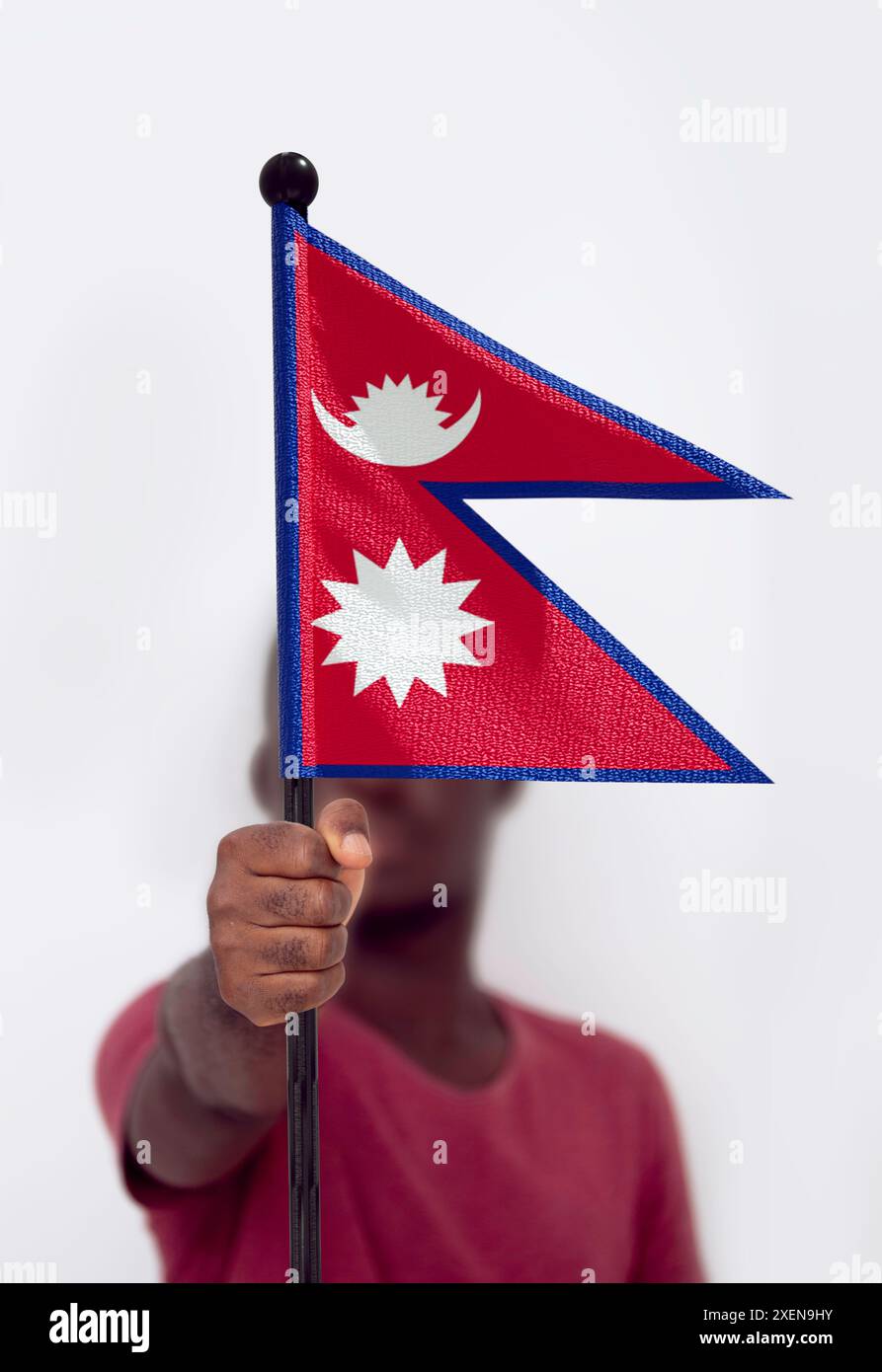 Black african male holding Nepalese national flag against white ...