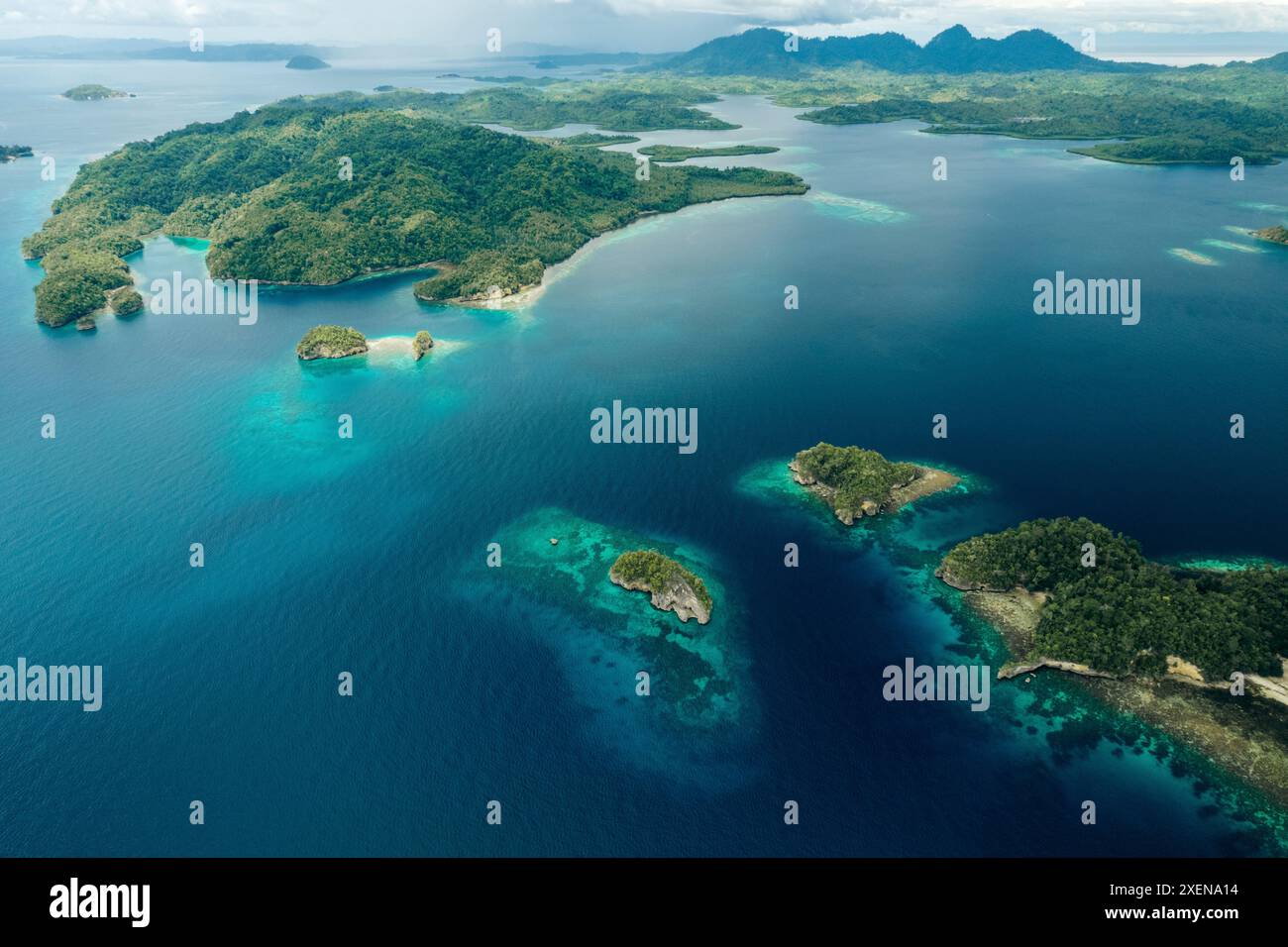 Islands with lush vegetation in Kepulauan Togean National Park; Wakai ...