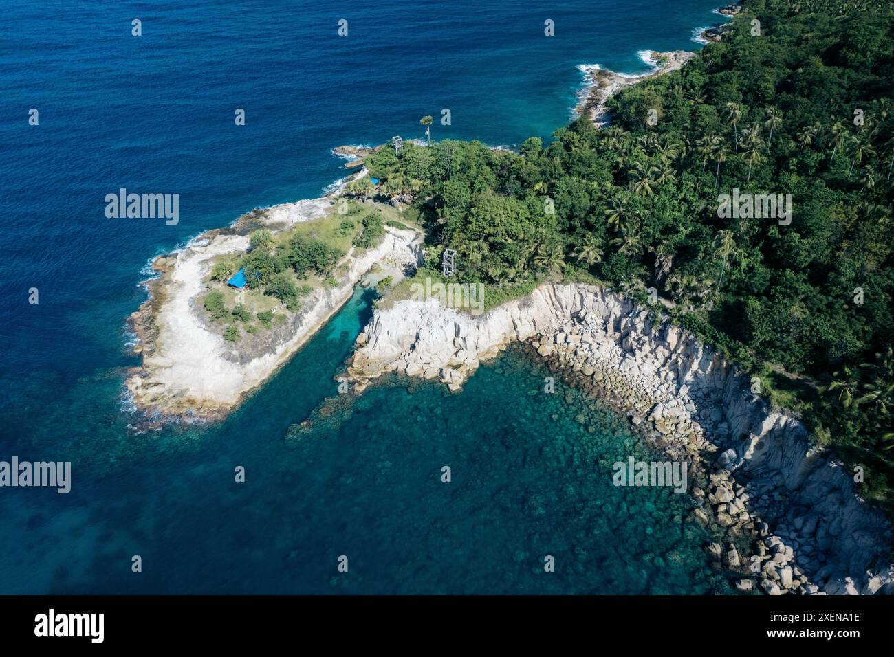 Aerial view of Patokan Beach (Jiko) with palm trees and cliffs in North ...