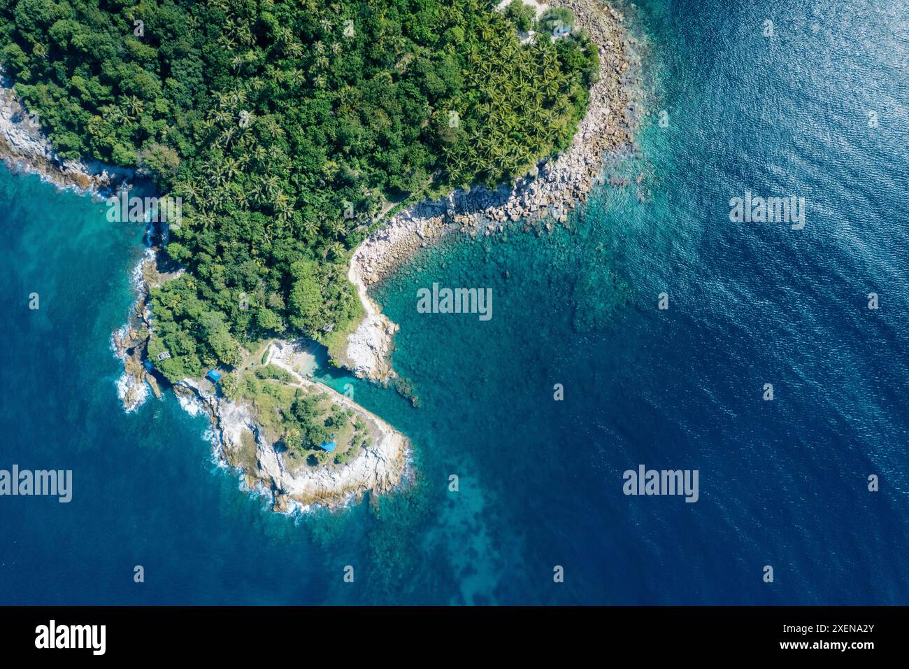 Aerial view of Patokan Beach (Jiko) with palm trees and cliffs in North ...
