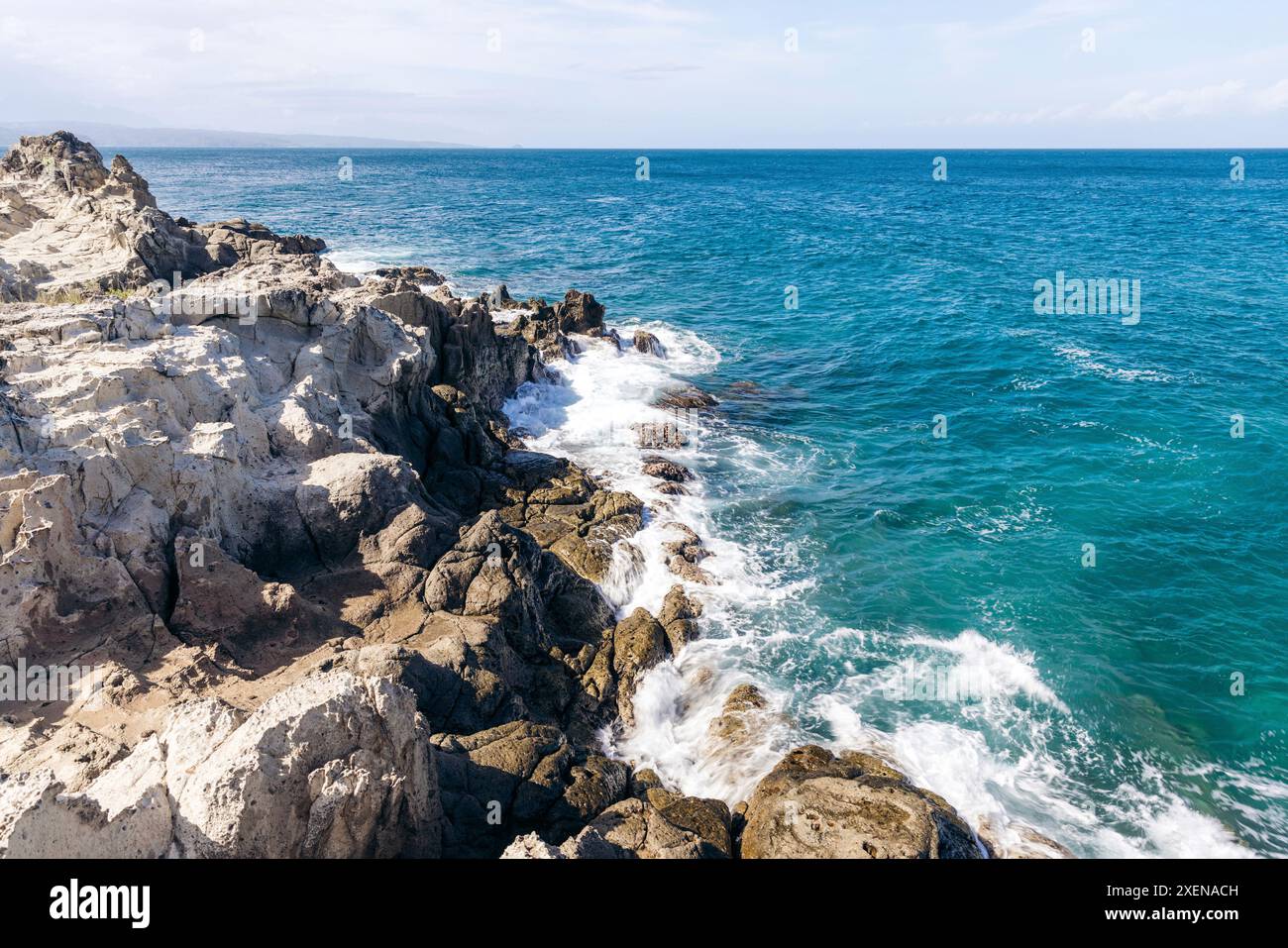Rugged coastline at Patokan Beach (Jiko) with a view out to the ocean ...