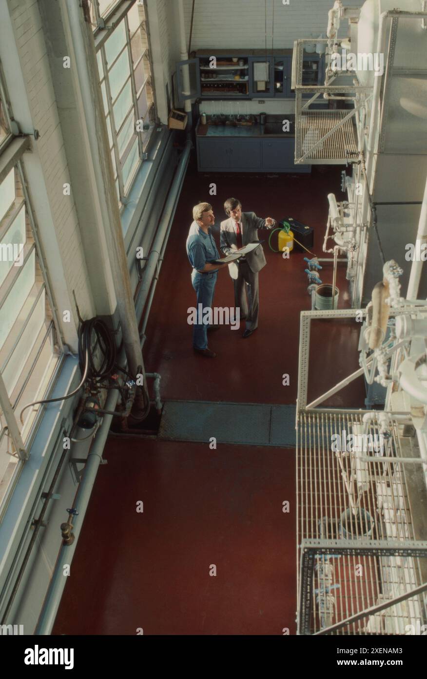 Salesman with customer in boiler-room Stock Photo - Alamy