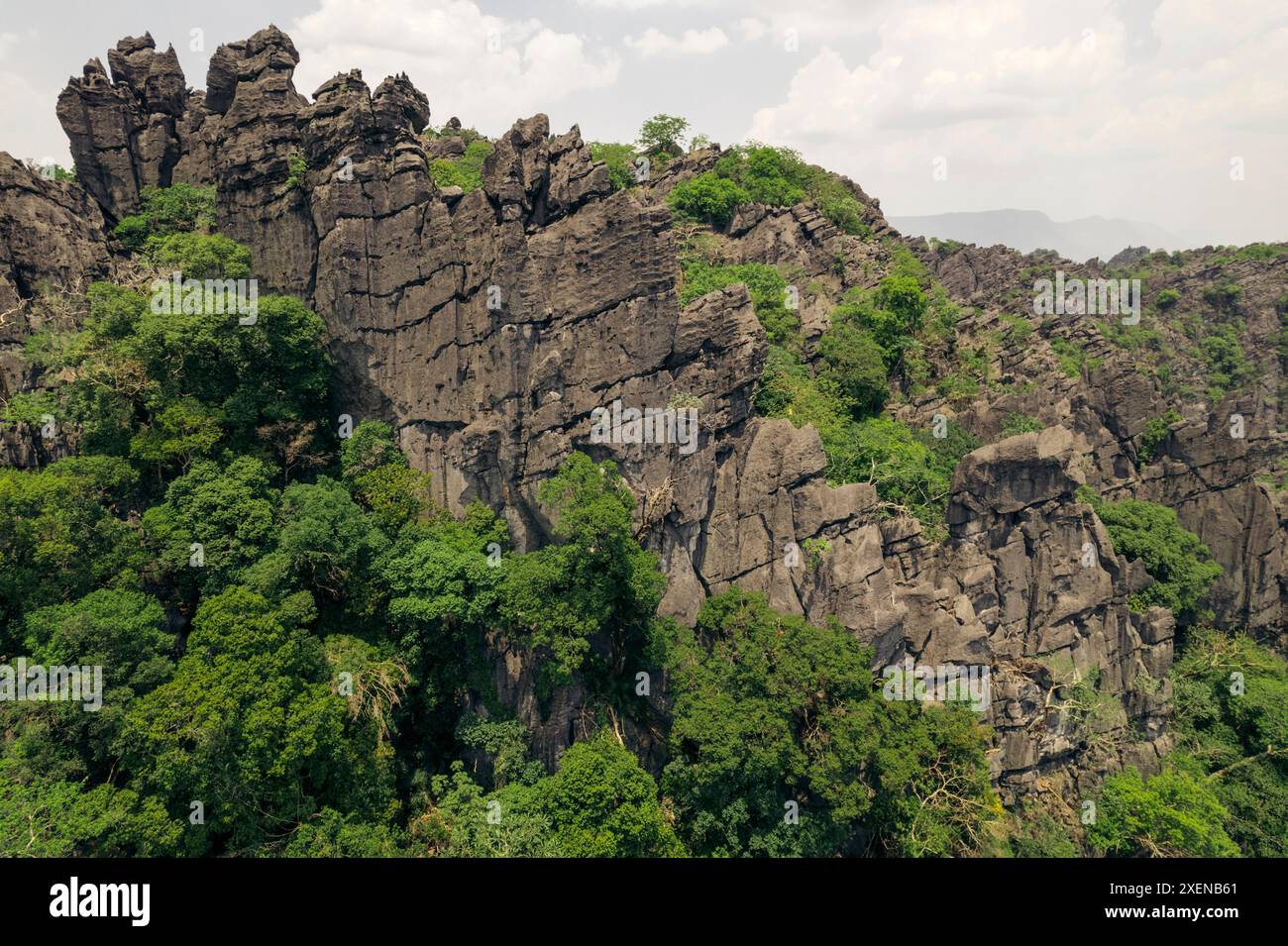 Limestone karst formations in sunset light in the Thakhek area of Laos ...