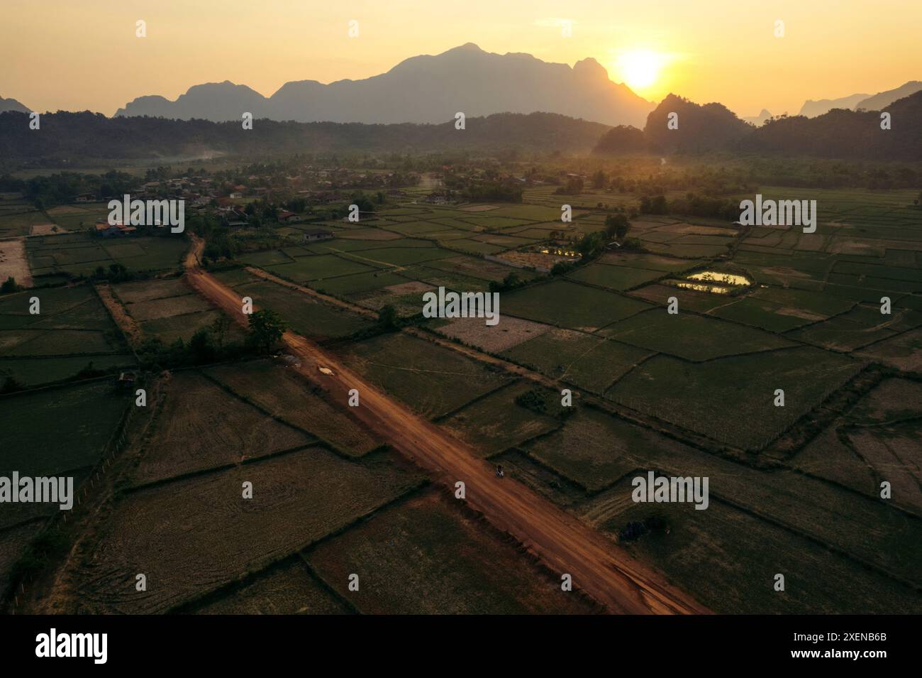 Aerial view of a fertile countryside at sunset in the Vang Vieng area ...