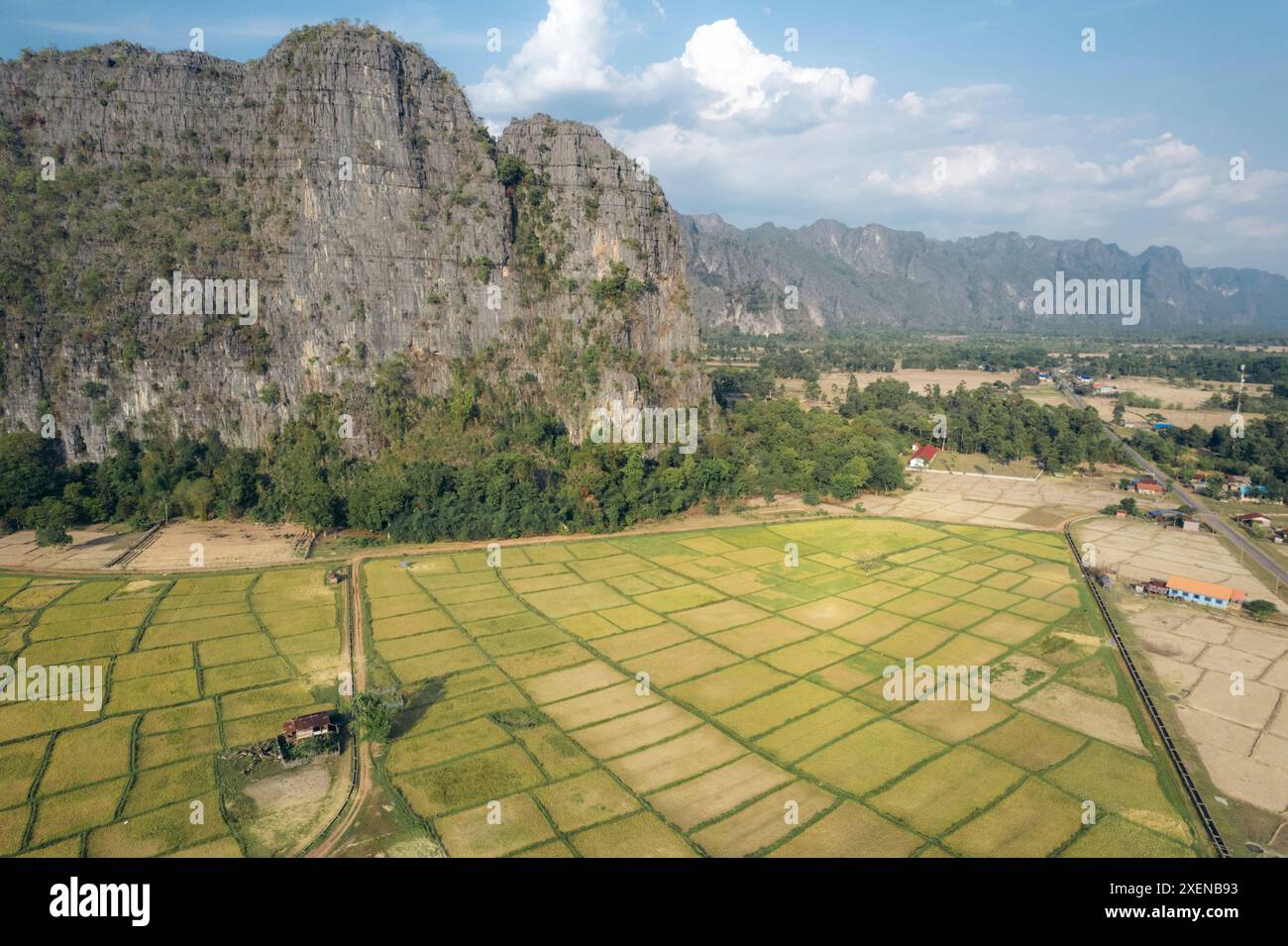 Limestone karst and rice fields in a valley near Kong Lor Cave in Laos ...