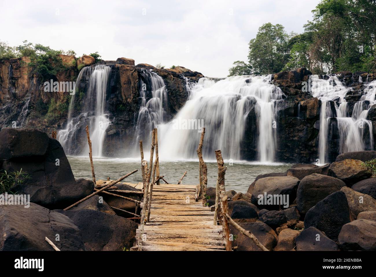 Beautiful splashing cascades of the Tad Lo Waterfall in Laos; Beng ...